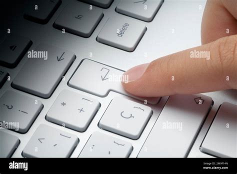 Index Finger Pressing Enter Key At Keyboard Fade Light Effect On Keyboard Stock Photo Alamy