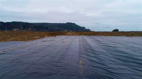 Geomembrane Deployment And Installation Process With Machinery In The