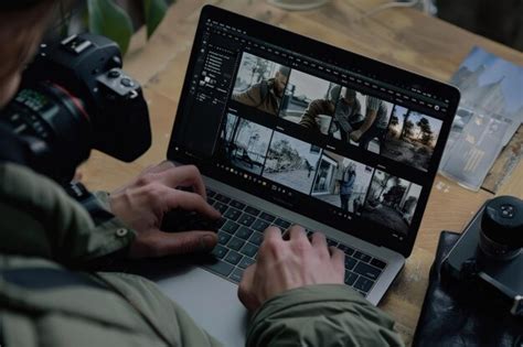 premium photo a man sitting in front of a laptop computer