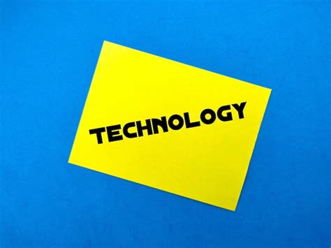 Premium Photo Colored Notepaper With Word Technology On A Blue Background