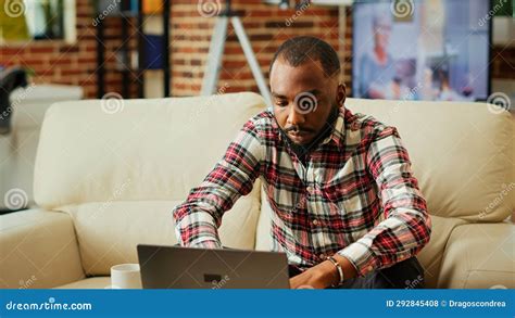 Teleworker Inputing Data On Laptop Stock Photo Image Of Relaxed