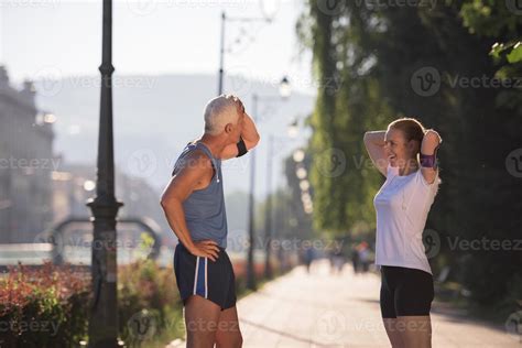 Jogging Couple Planning Running Route And Setting Music 11012119 Stock Photo At Vecteezy