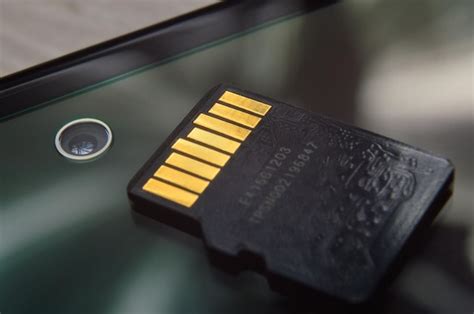 Premium Photo Micro Sd Card Lies On The Smartphone Screen Closeup