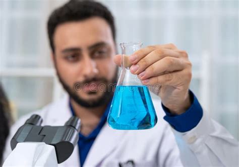 Scientist Male Wearing White Laboratory Coat And Working In Scientific Research Laboratory While