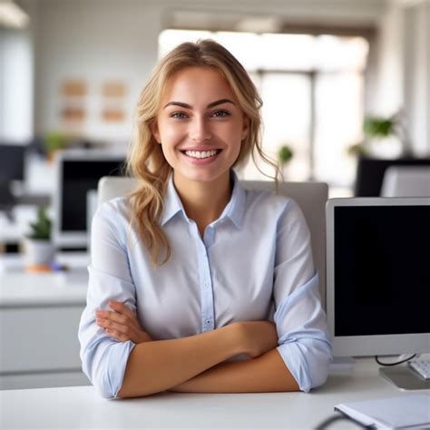 Premium Ai Image A Woman Sits In Front Of A Computer With A Smile On Her Face