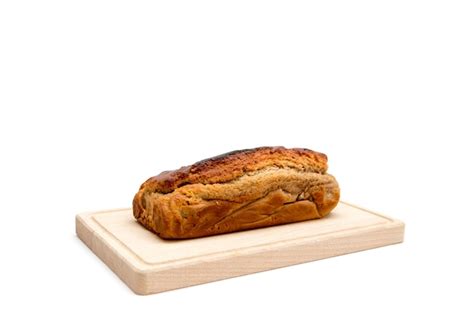 Premium Photo Close Up Of Bread On Cutting Board Against White Background