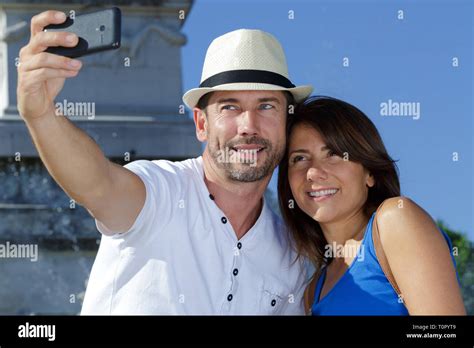 Couple Doing Selfie Using Timer Stock Photo Alamy