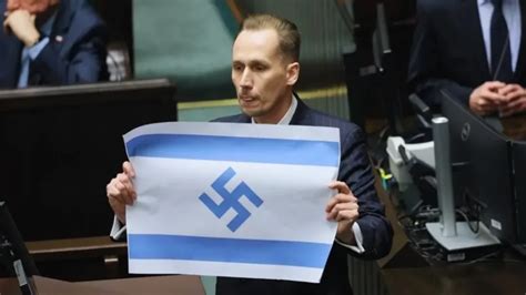 Polish Mp Sparks Outrage By Displaying Israeli Flag With Swastika