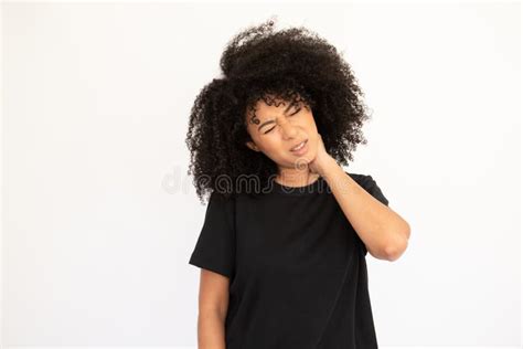 Portrait Of Stressed Young Woman Touching Aching Neck Stock Image