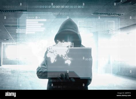 Hacker In Black Hoodie Holding Laptop On The Room With Virtual Screen