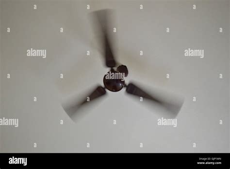 This Image Captures A Rotating Ceiling Fan Frozen At 1 80th Of A Second Showcasing The Motion