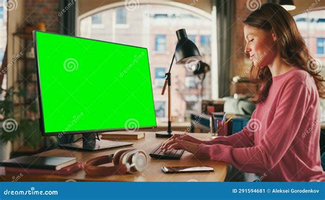 Young Beautiful Adult Woman Working From Home On Desktop Computer With Green Screen Mock Up