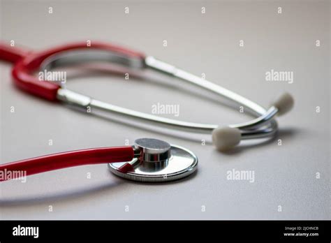 Red Stethoscope In Doctors Office For Professional Cardio Checkup And Healthy Heartbeat Pulse