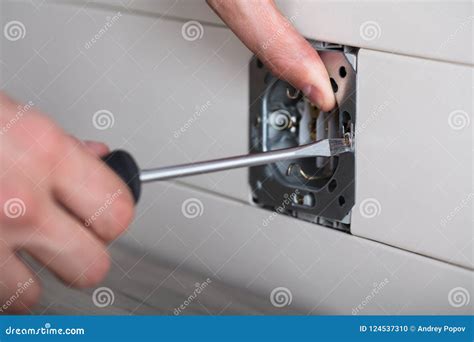 Person S Hand Repairing Electrical Socket Stock Photo Image Of Home Metal