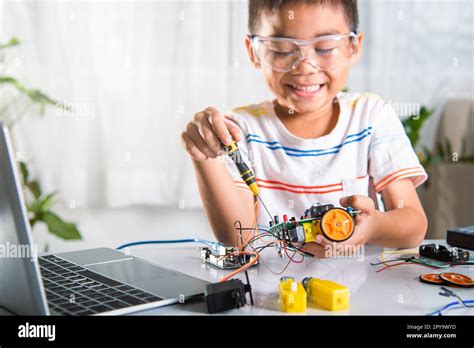 Asian Kid Babe Assembling The Arduino Robot Car Homework Project At Home Stock Photo Alamy