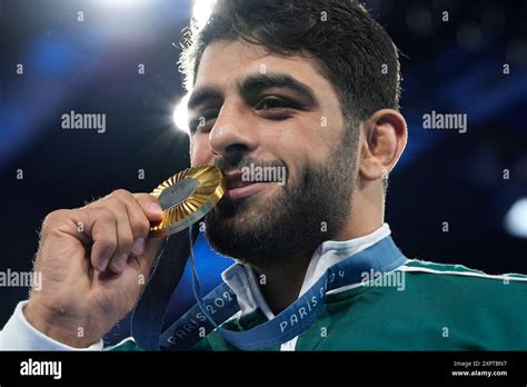 Irans Mohammadhadi Saravi Celebrates With His Gold Medal During The