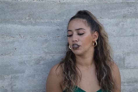 Latin And Hispanic Girl Young And Nonconformist Rebellious Smoking A