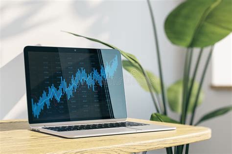 Close Up Of Laptop On Wooden Desktop With Glowing Candlestick Forex Chart On Screen And Concrete