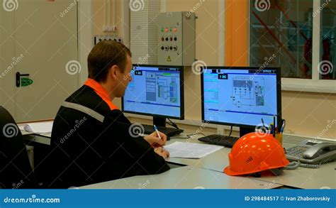 industrial operator at plant checks machinery ensuring industry