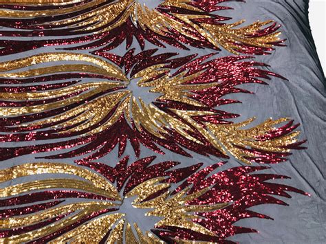 Angel Wings Sequins Fabric Burgundy Gold On Black 4 Way Stretch