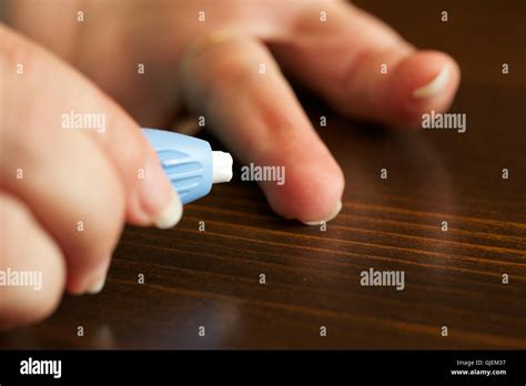Woman Using Safety Lancet To Draw Blood From Finger For Test Stock Photo Alamy