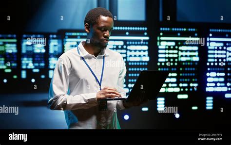 african american specialist ensuring server farm systems provide