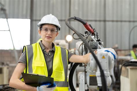 Premium Photo Male Engineer Using Computer Control Panel Cnc Machine Operating At Factory