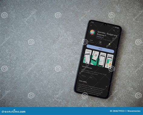 Spendee App Play Store Page On Smartphone On Ceramic Stone Background