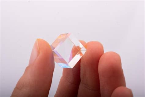 Premium Photo Optical Glass Cube In Hand Light Dispersionspectrum Premium Photo Optical Glass Cube In Hand Light Dispersionspectrum