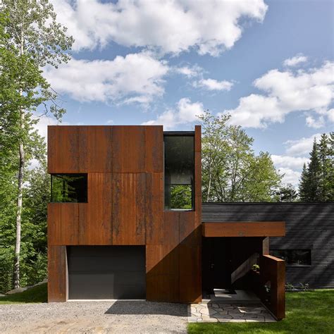Canadian Lake House By Paul Bernier Features Dark Rusted Metal Cladding