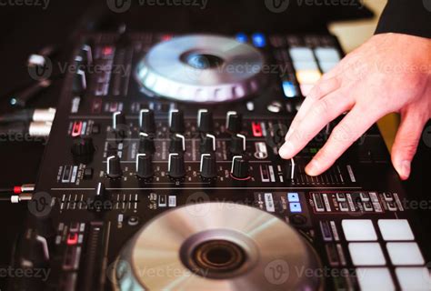 DJ Plays And Mix Music On Digital Midi Controller Stock Photo At Vecteezy