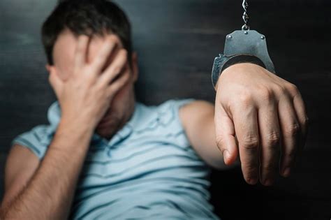 Premium Photo Prisoner Or A Slave In Captivity The Upset Man Is Handcuffed The Prisoner Is In