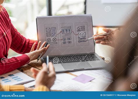 Group Of Ux Developer And Ui Designer Brainstorming About App Interface Design At Modern Office