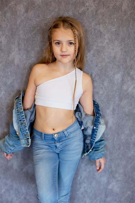 Premium Photo A Longhaired Blonde Girl With Big Eyes In A White