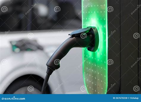 Electric Car EV Is Charging In Socket With Cable Stock Photo Image Of Transportation