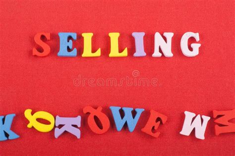 Selling Word On Red Background Composed From Colorful Abc Alphabet Block Wooden Letters Copy