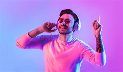 Guy With Glasses And Wireless Headphones Enjoys Music Stock Image Image Of Online Listen