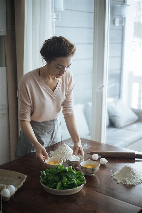 Woman Preparing To Make Dough By Stocksy Contributor Pietro Karras Stocksy