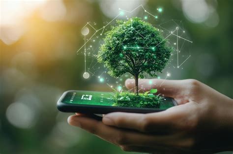 Green Tree Growing On A Smartphone In A Hand Representing Technology