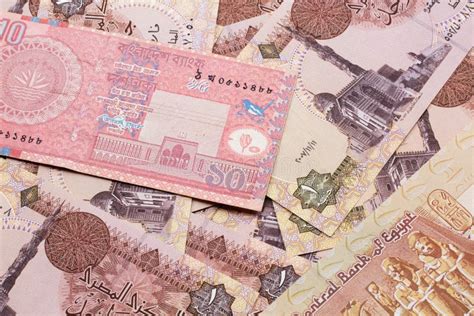 A Ten Taka Note From Bangladesh On A Background Of Dollar Bills Stock Image Image Of Gold