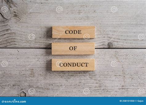 Code Of Conduct Sign Spelled On A Stack Of Three Wooden Blocks Stock