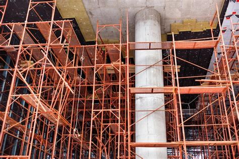Premium Photo Metal Scaffolding In The Process Of Insulating The