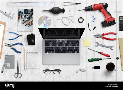 Computer Hardware Service Desk Laptop With Blank Screen Surrounded With Repair Tools Top View