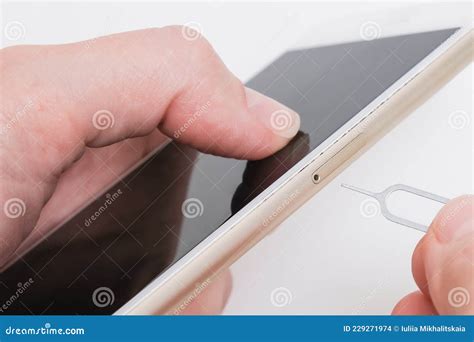 Removing A Sim Card Out Of A Smartphone Replacing Simcard And Changing Number Stock Photo