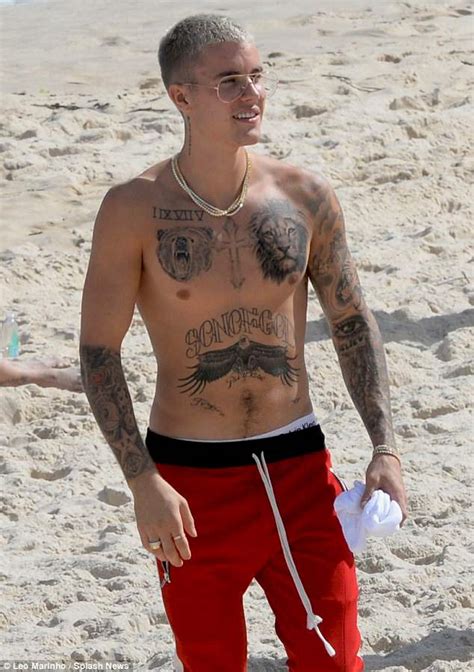 Justin Bieber Flaunts Heavily Tattooed Chest As He Reveals He S Spent Over Hours Getting
