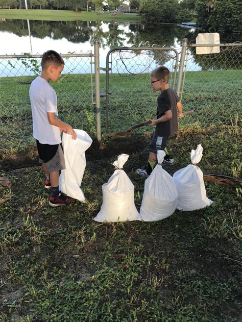 My Two Oldest Sons 10and6 3rd Is 6mo Helping To Get Ready For The Hurricane They Filled 53
