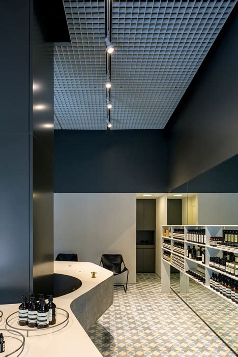 são paulo aesop store has pastel flooring and concrete plinths