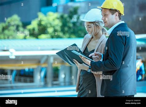 Portrait Of Multiethnic Architect With Blueprints And Business Industrial Man Engineer At