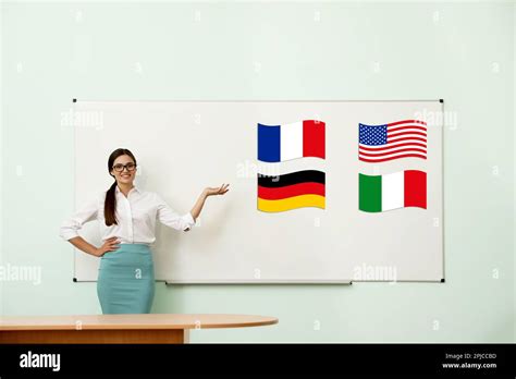 Foreign Languages Teacher Near Whiteboard With Different Flags In