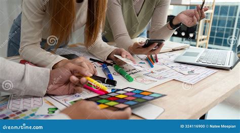 Creative Ux Developer And Ui Designer Brainstorming Session With Color Palettes And Wireframes